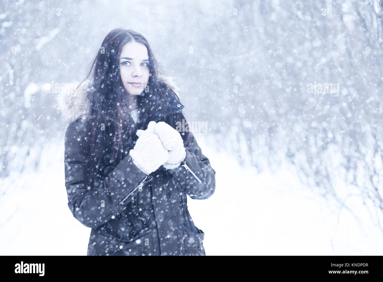 Beautiful girl in a beautiful winter snow Stock Photo - Alamy