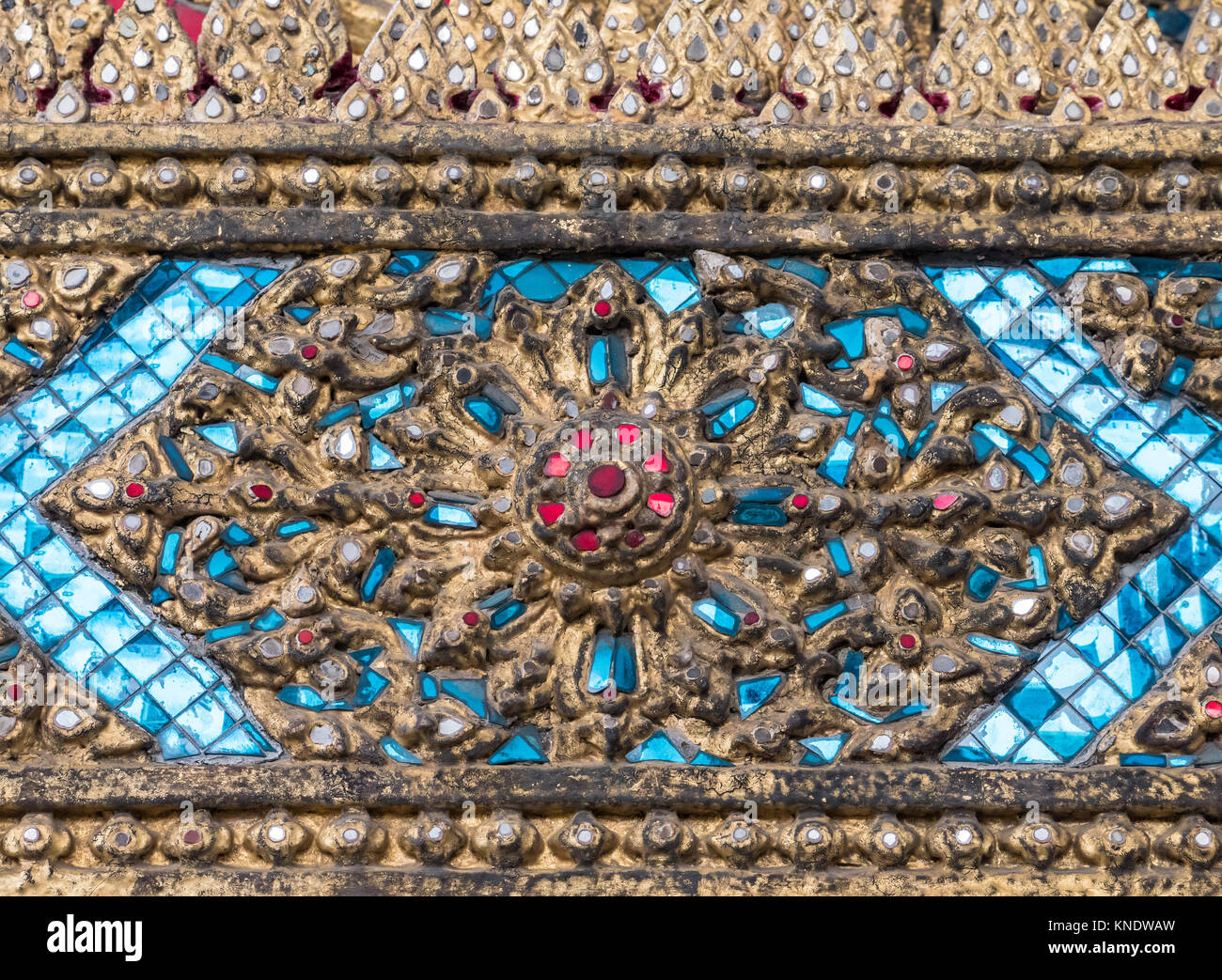 Ancient flower pattern in the traditional Thai style with blue mosaic ...