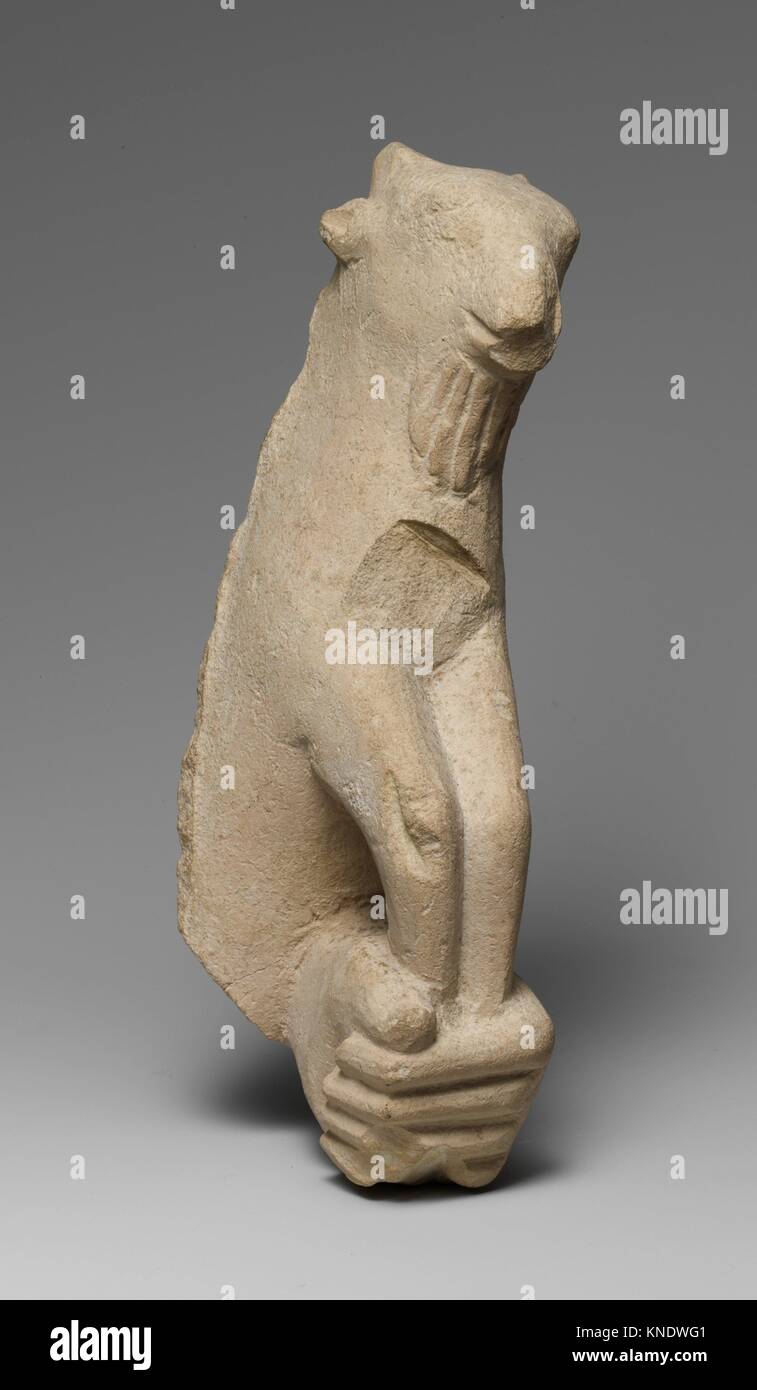 Limestone statue fragment of a left hand holding a kid. Period: Late ...