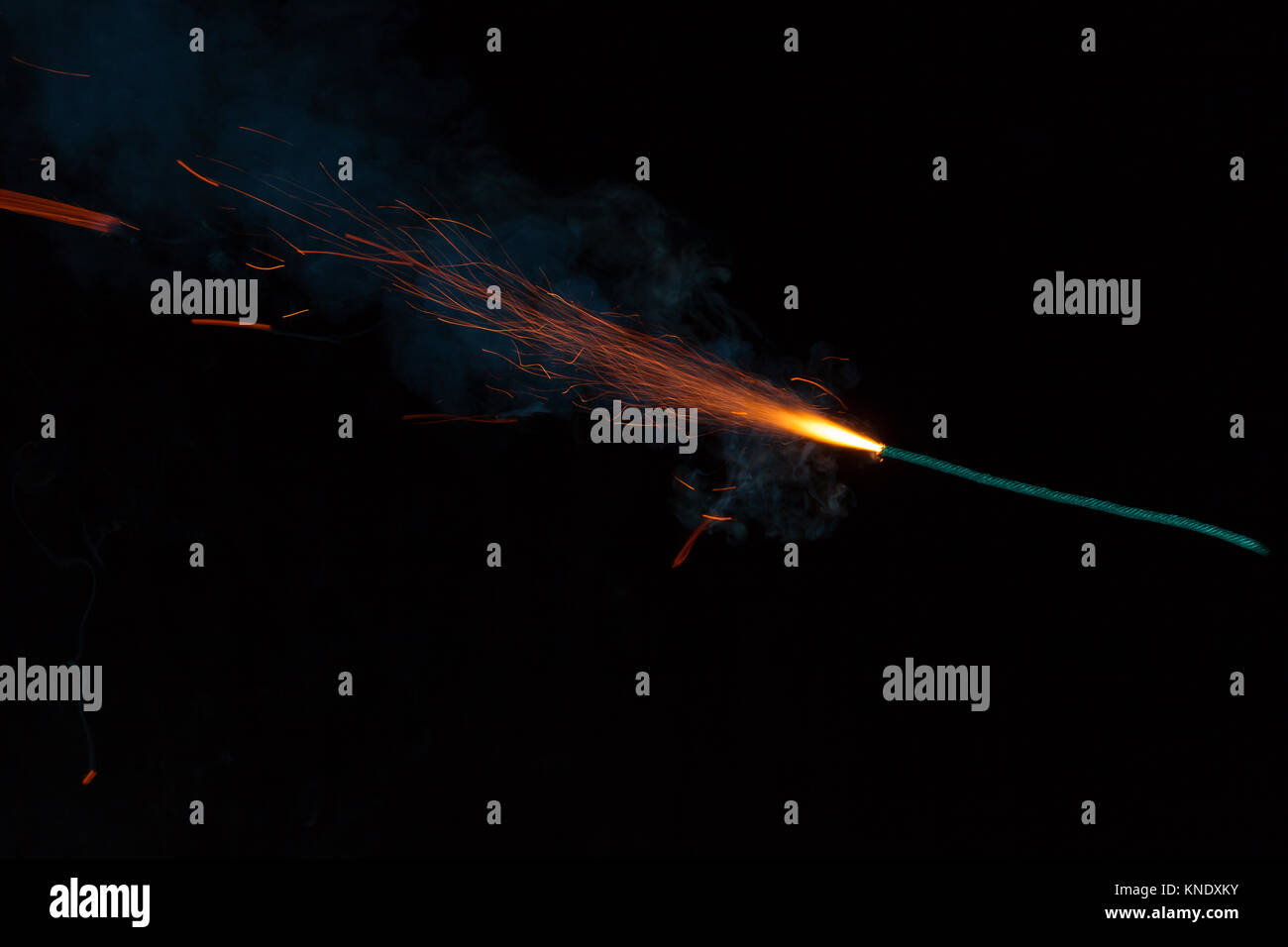 Burning fuse with sparks and blue smoke on black background Stock Photo ...