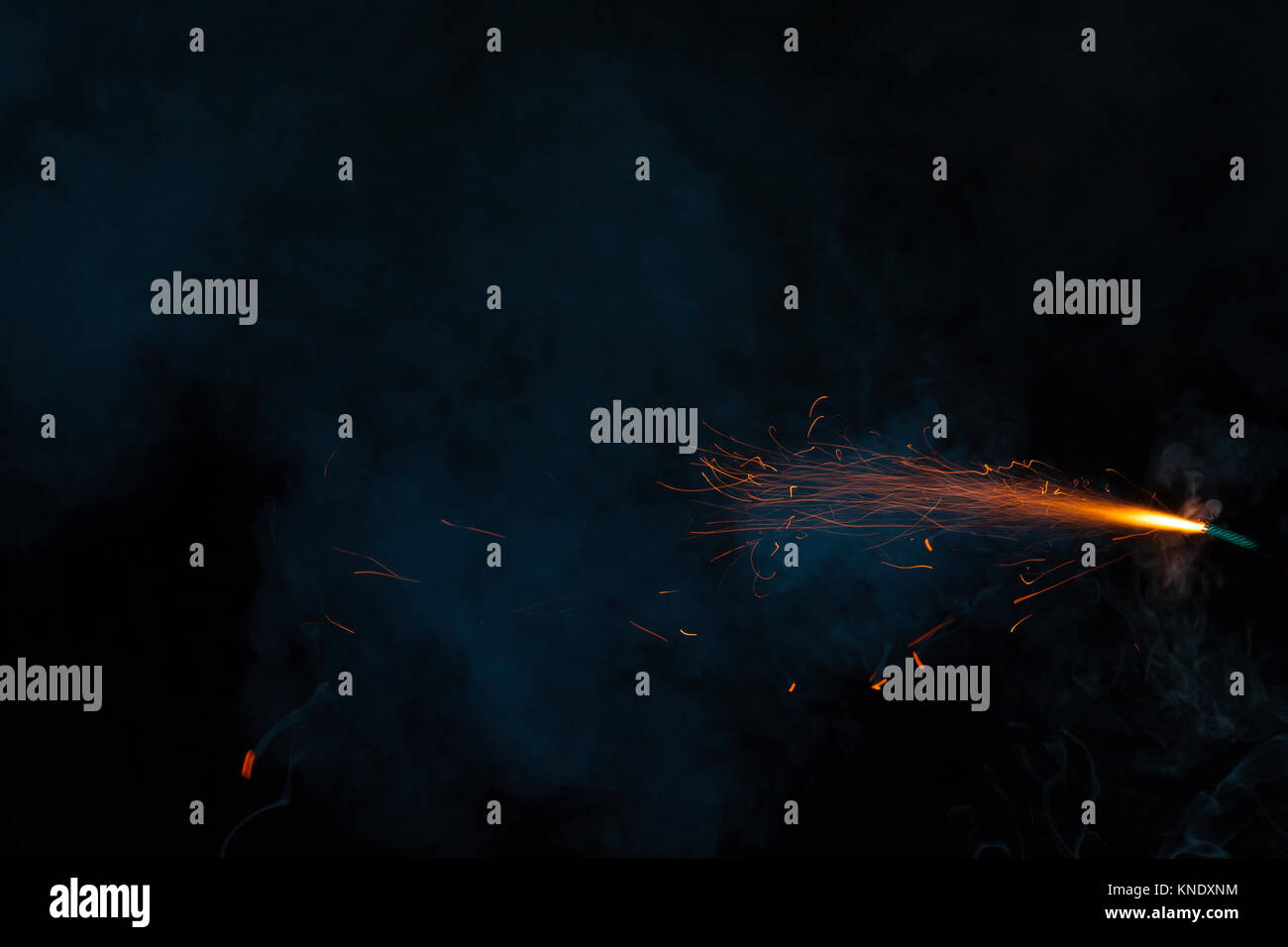 Burning fuse with sparks and blue smoke on black background Stock Photo ...