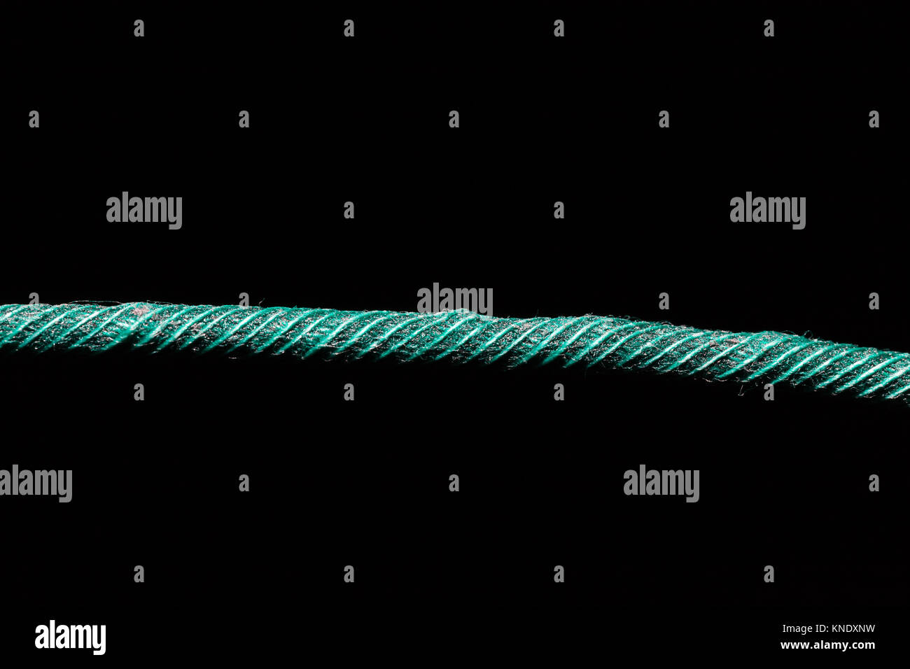 Close-up of green fuse on black background Stock Photo - Alamy