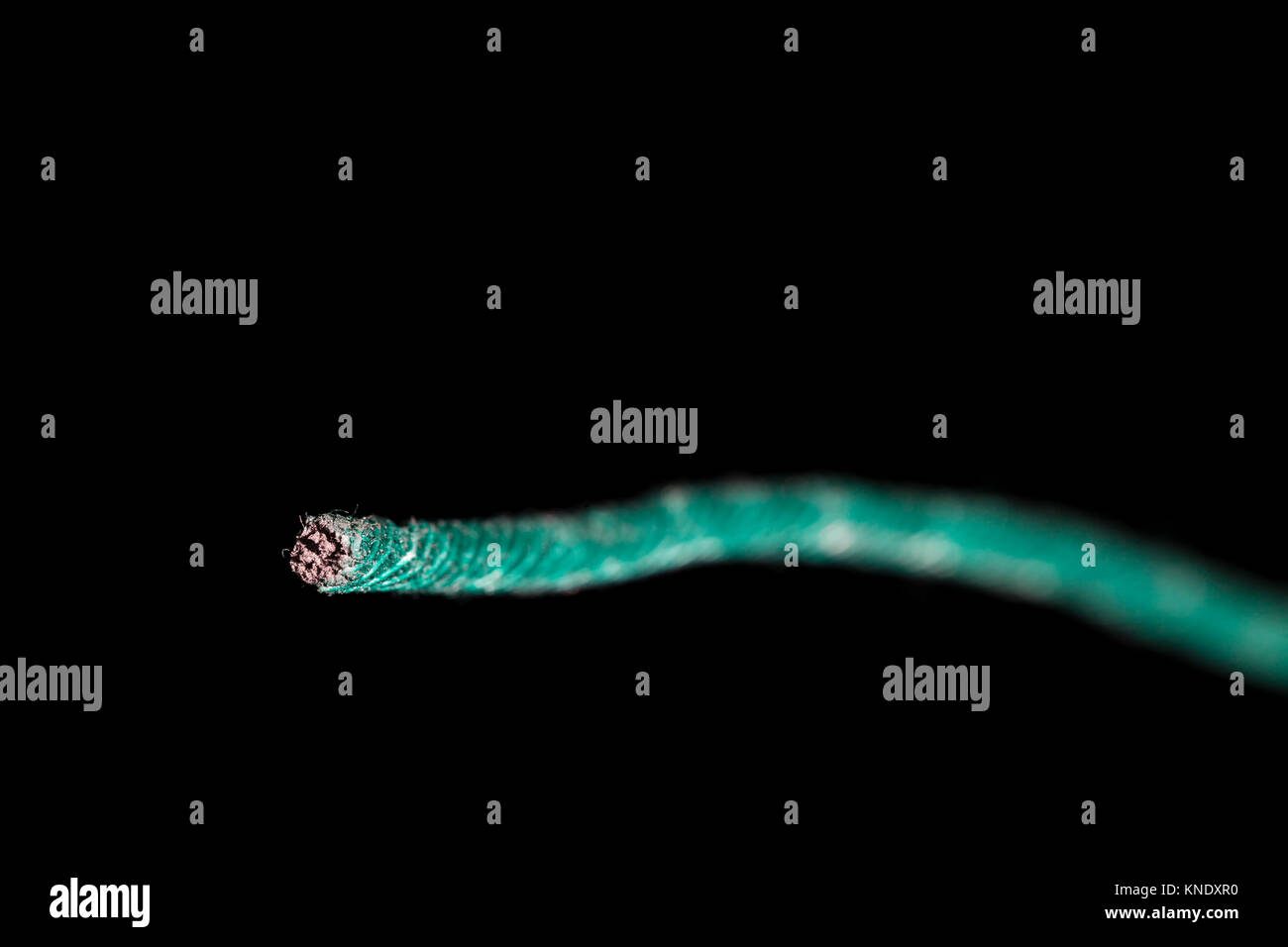 Close-up of green fuse end on black background Stock Photo - Alamy