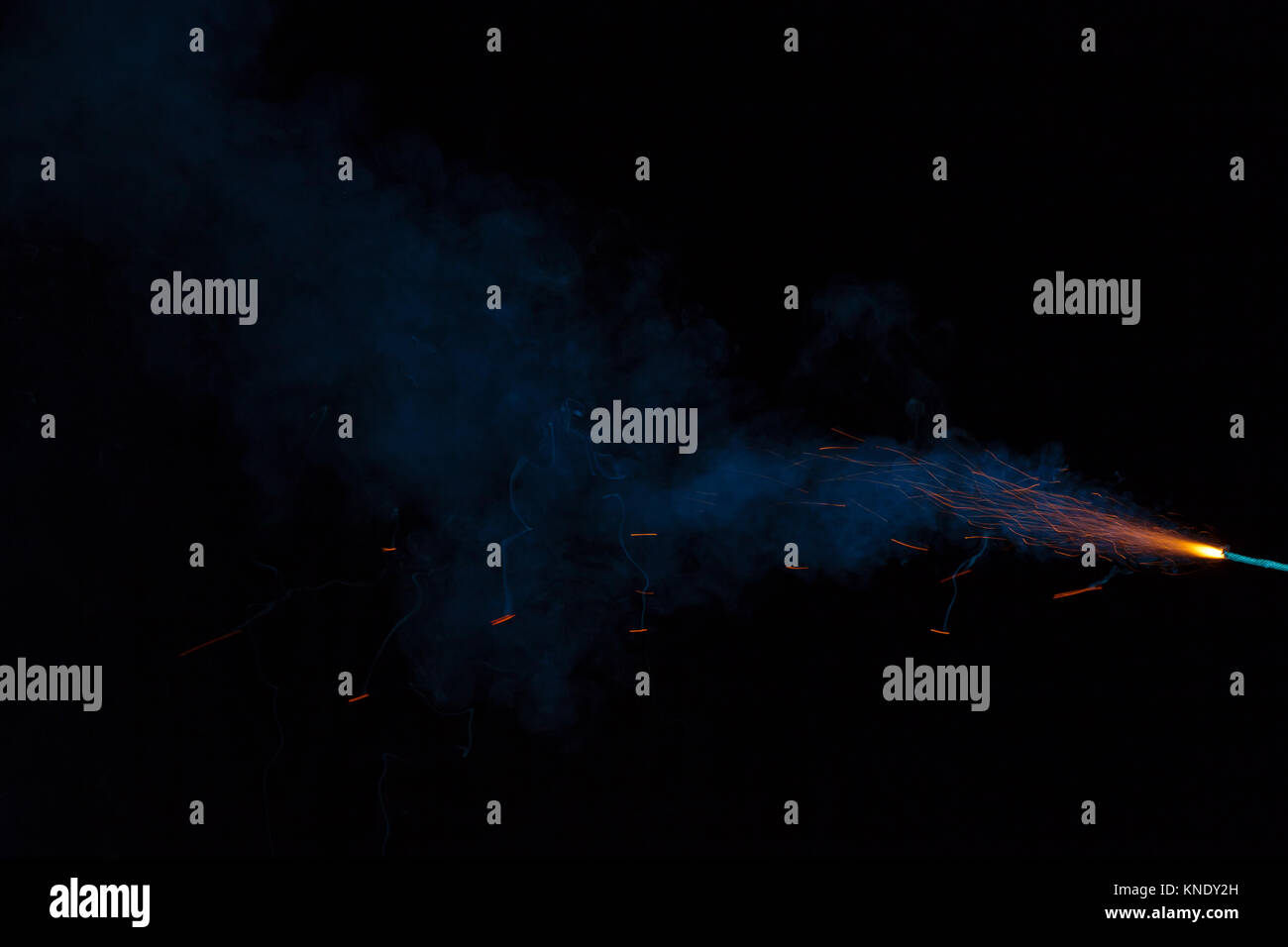 Burning fuse with sparks and blue smoke on black background Stock Photo ...