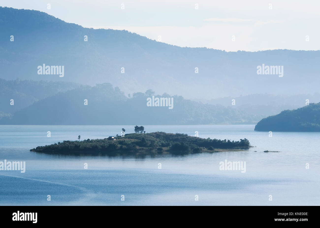 beautiful landscape with island in the middle of the sea with mountains ...
