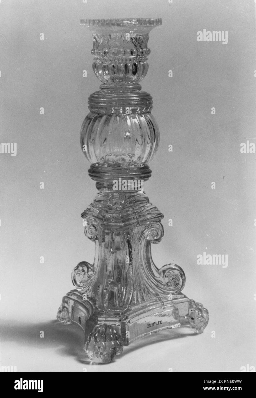 This American candlestick, made of lacy pressed glass, dates from 1830 ...