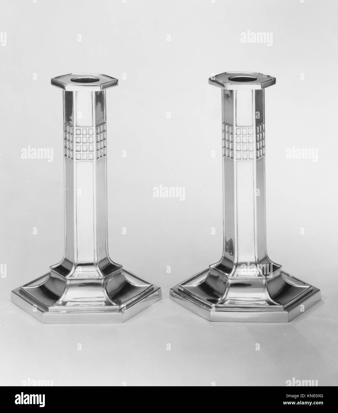 This silver-plated candlestick, made by Pairpoint Manufacturing ...