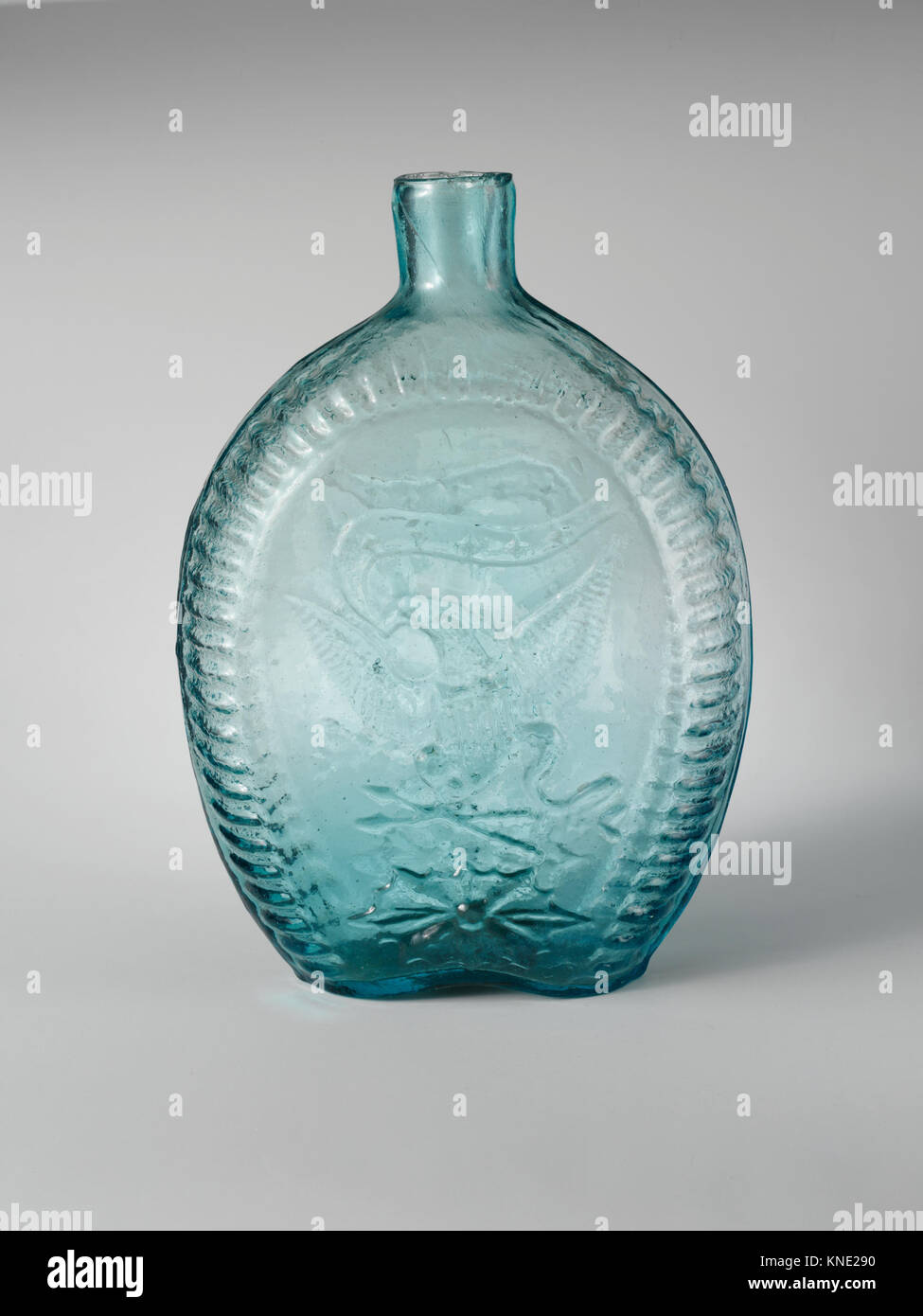 This flask, crafted from metal, is an example of historical functional ...