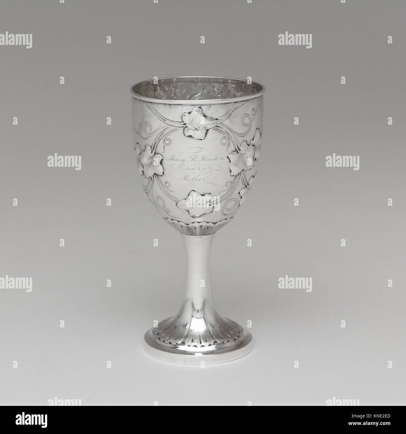 This goblet, crafted from metal and designed with intricate patterns ...