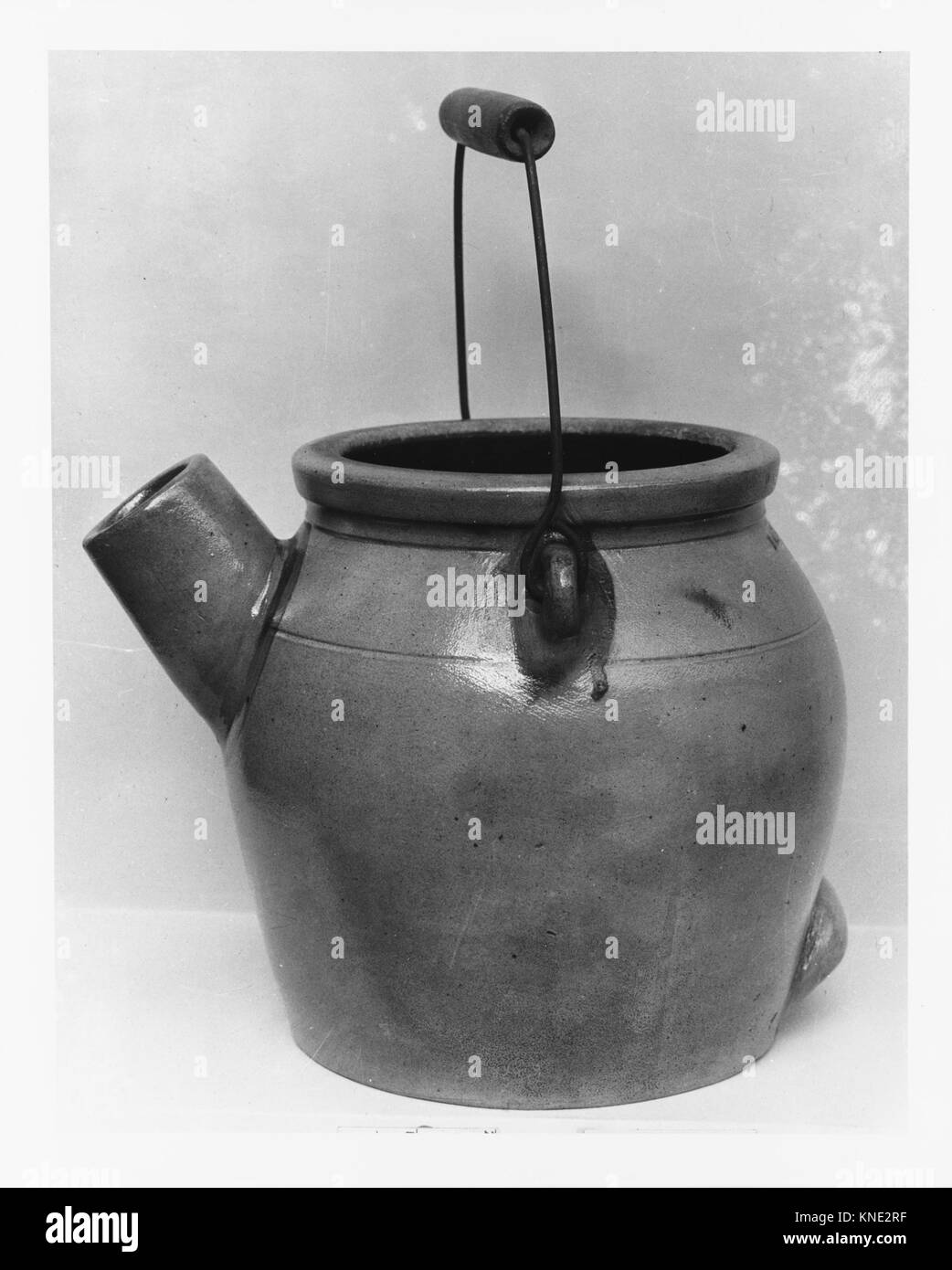 This batter jug is a functional ceramic vessel used in cooking ...