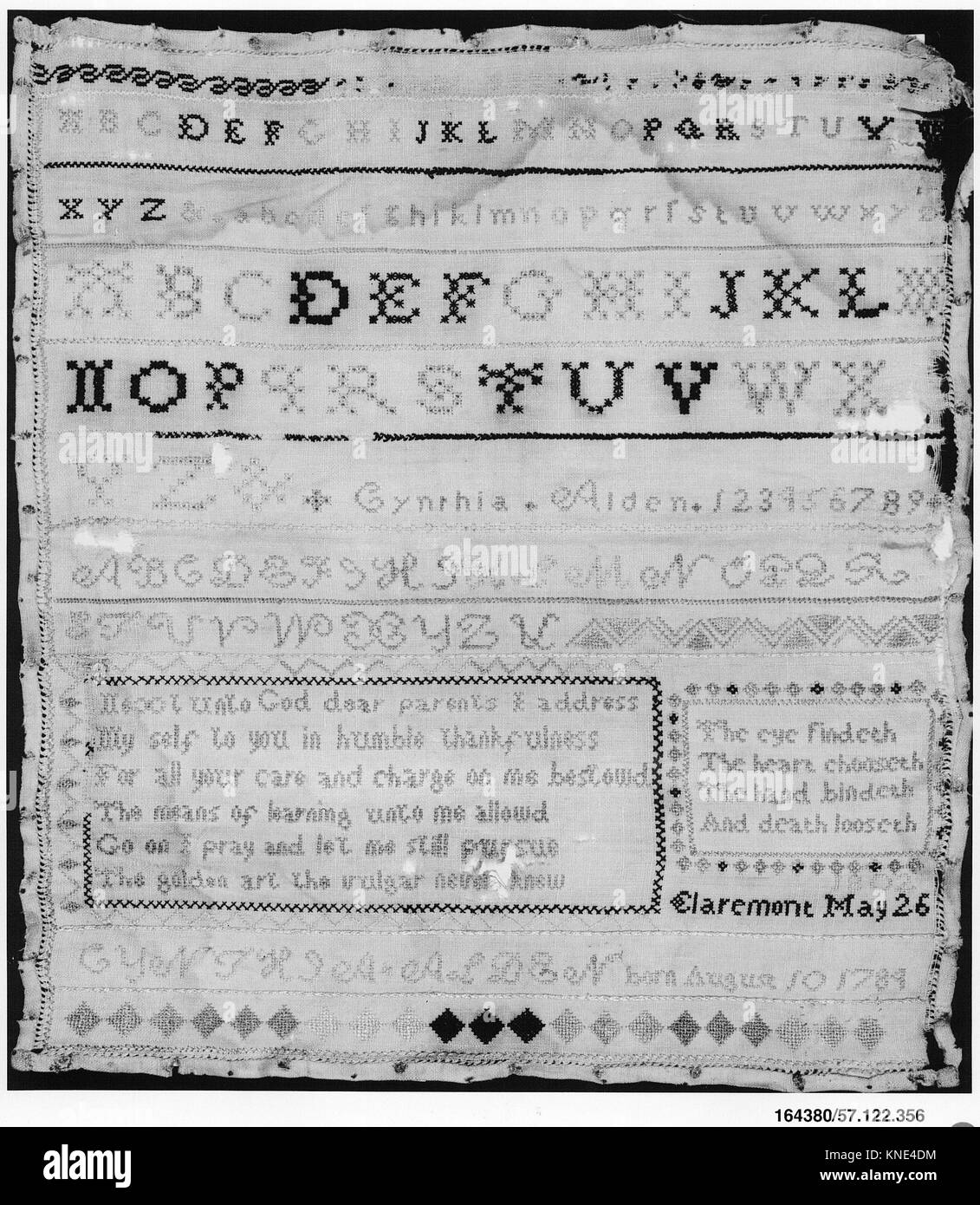 This embroidered sampler showcases intricate needlework patterns, often ...