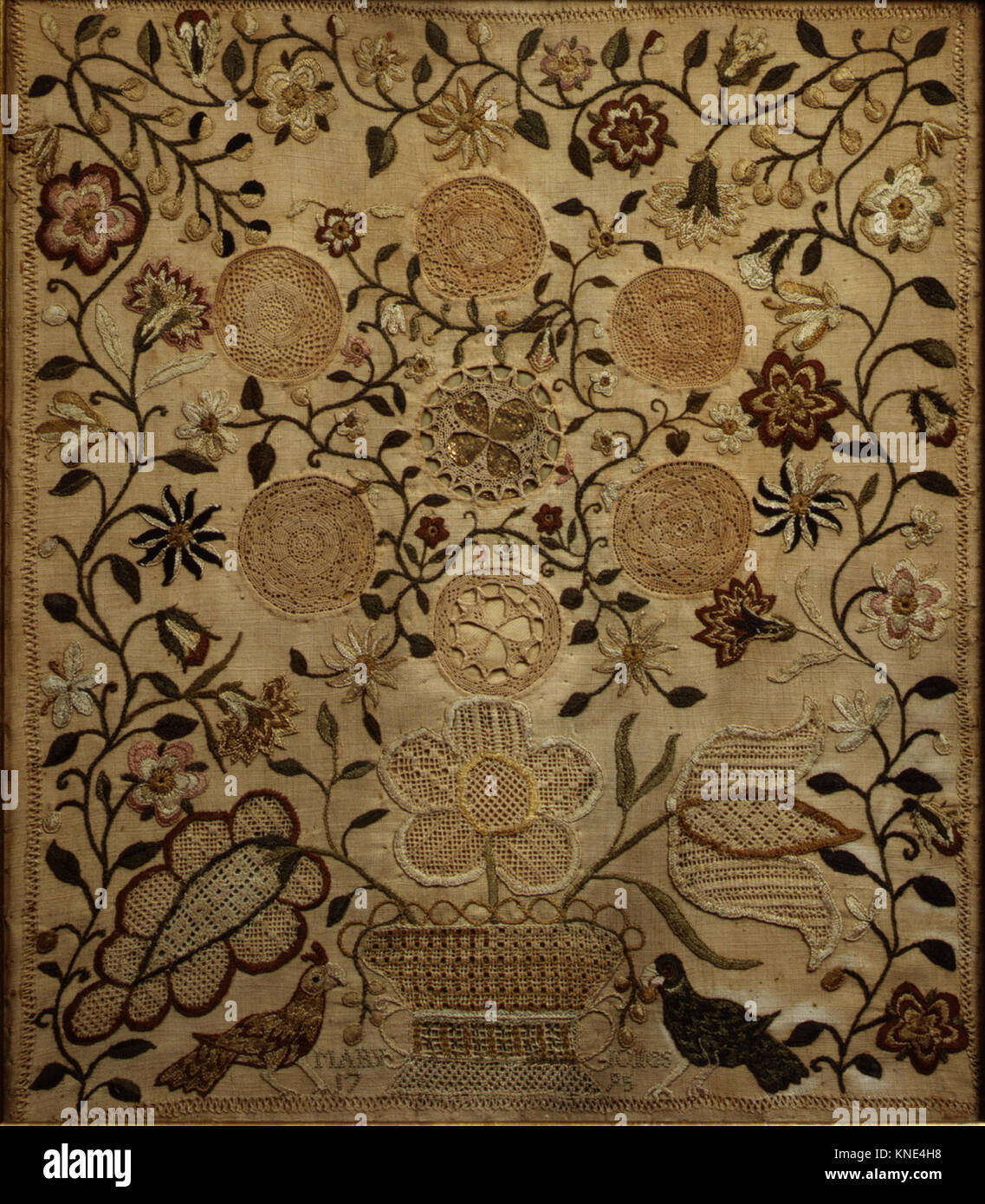 This embroidered sampler features detailed needlework, demonstrating ...