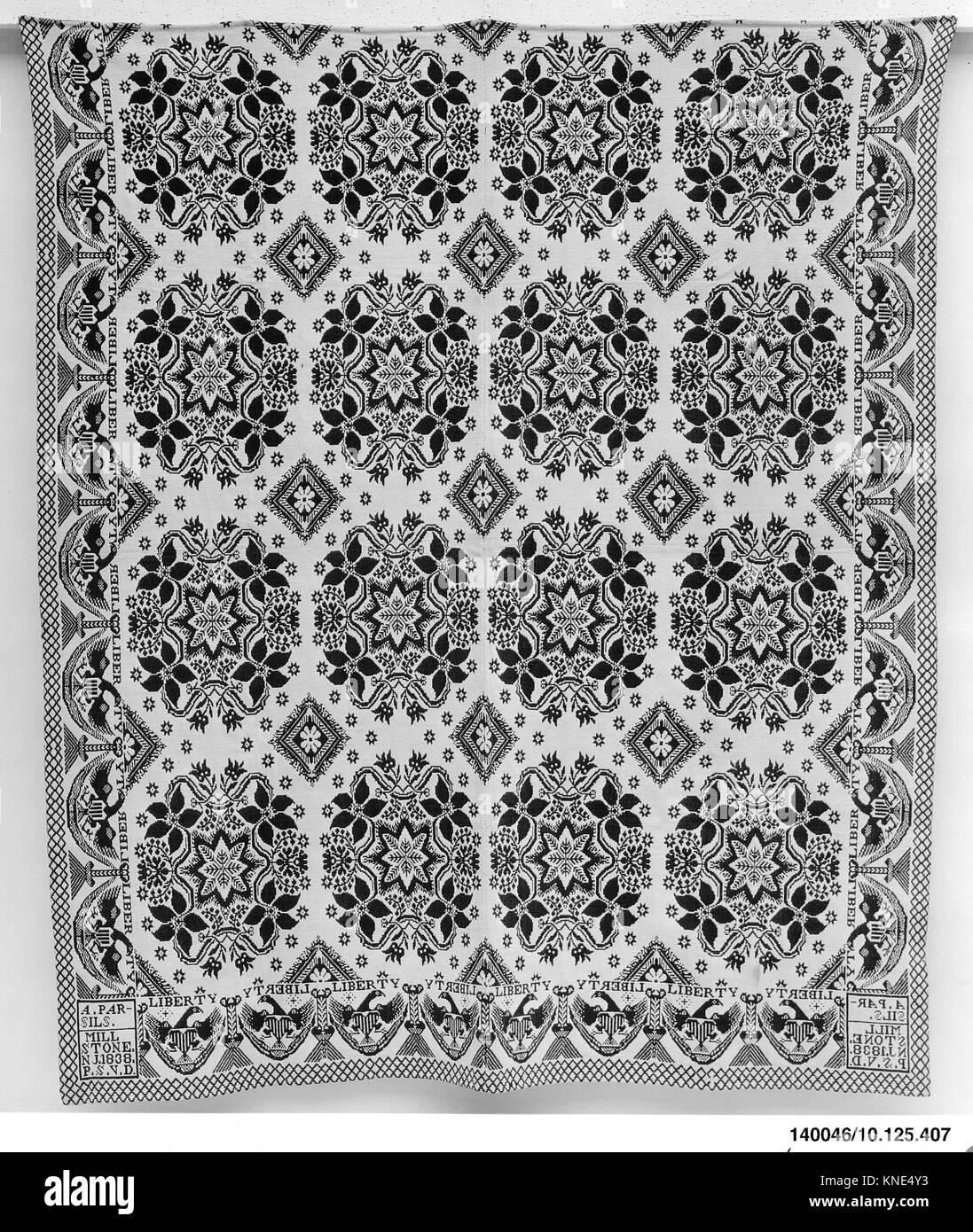 This coverlet features a *Lilies of France* pattern, with borders ...