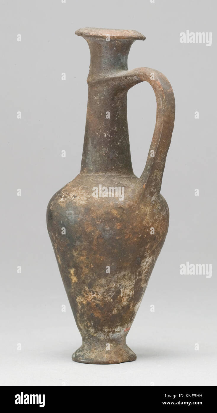 This Cypriote ring-based juglet features distinct artistic design ...