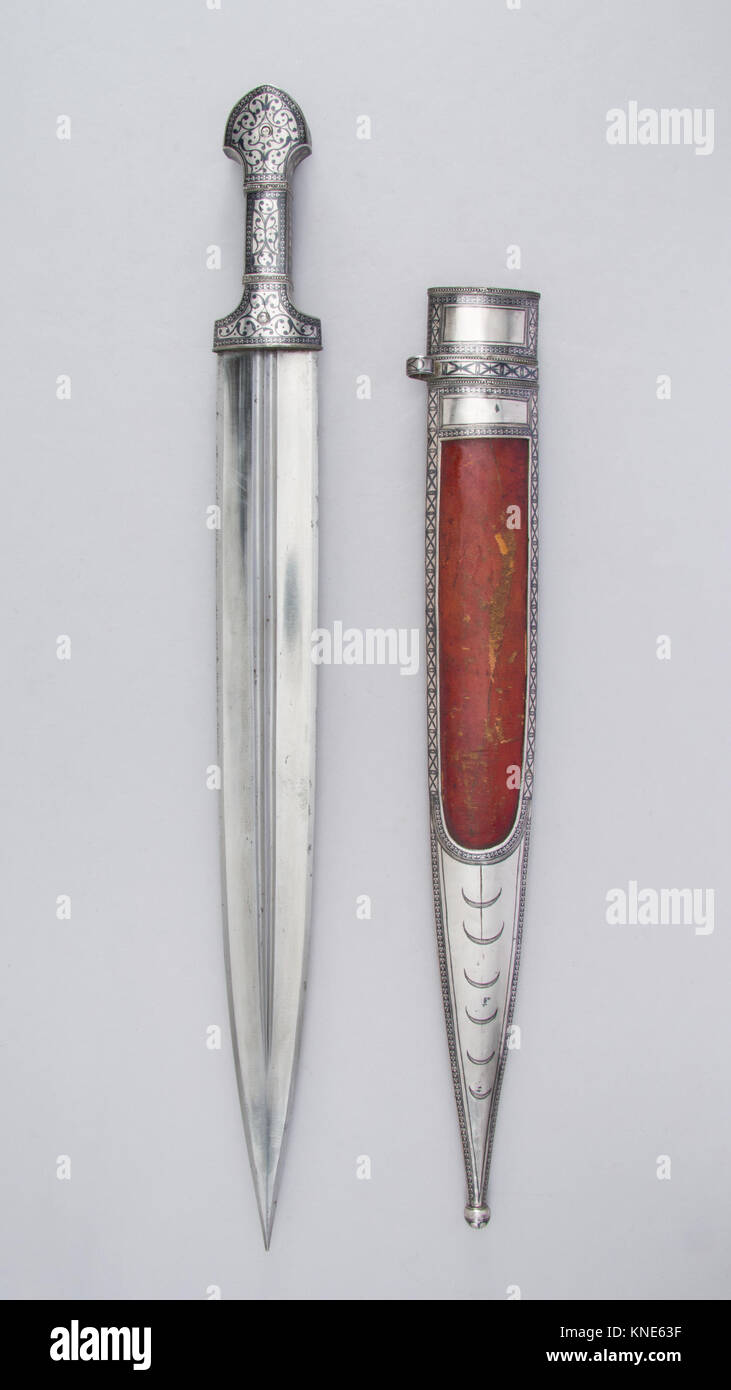 This Kindjal dagger, with its accompanying sheath, is a traditional ...