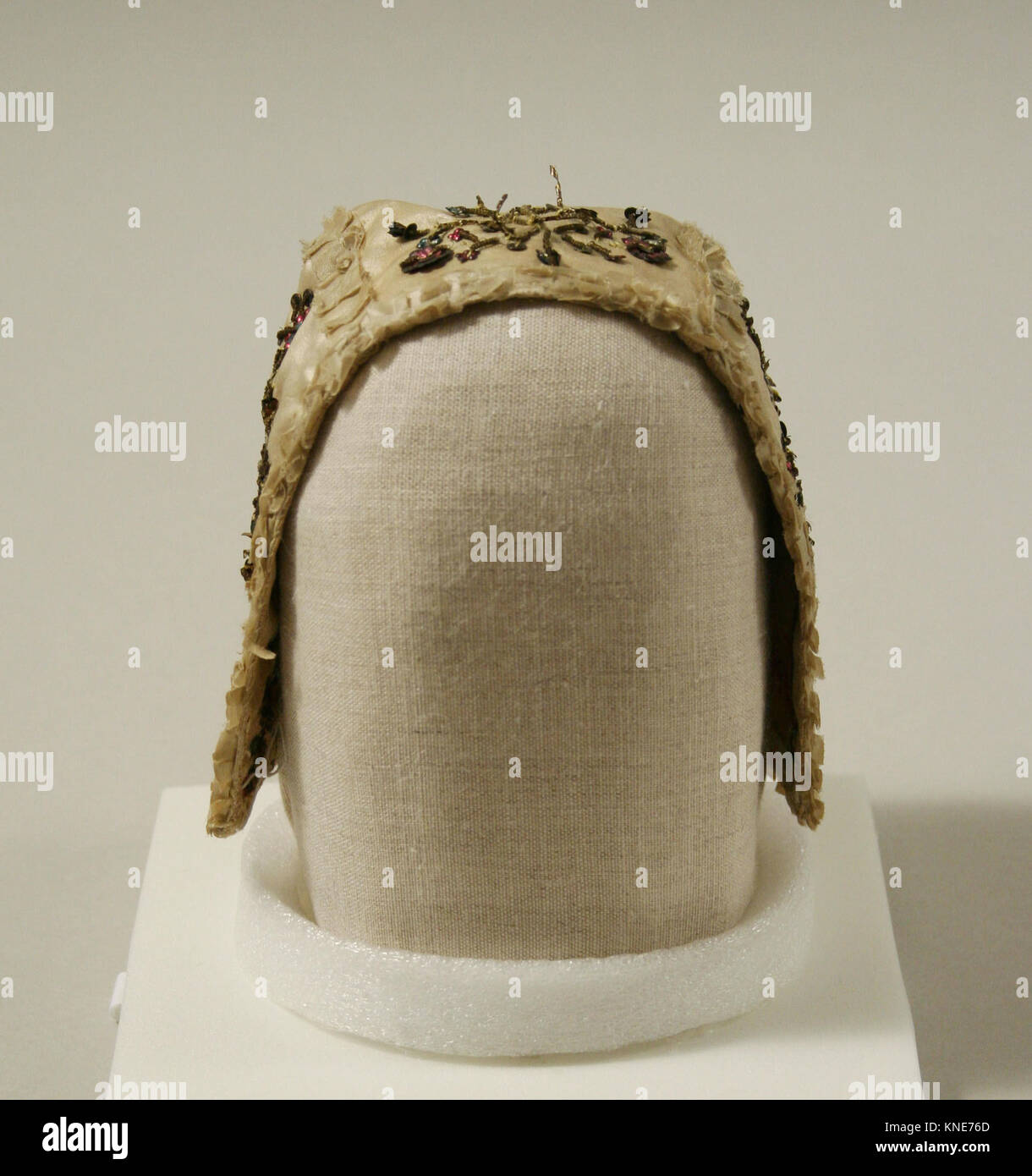 A cap made from fine materials, part of traditional costume, reflecting ...