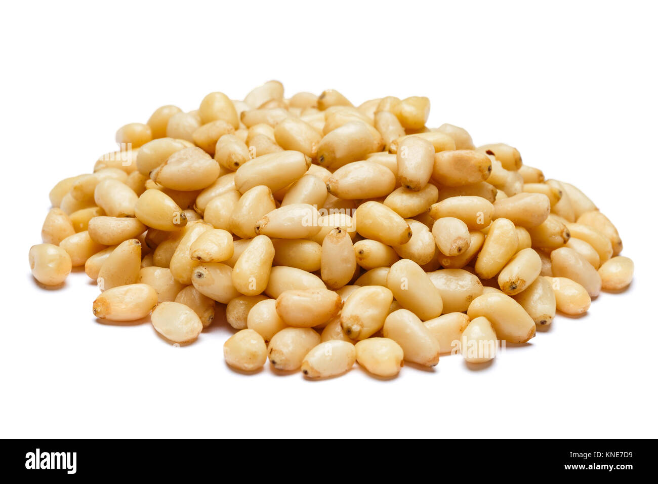 Pine nuts isolated on white Stock Photo - Alamy