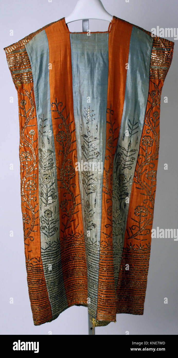 This historical dress, featuring intricate fabric patterns and a unique ...