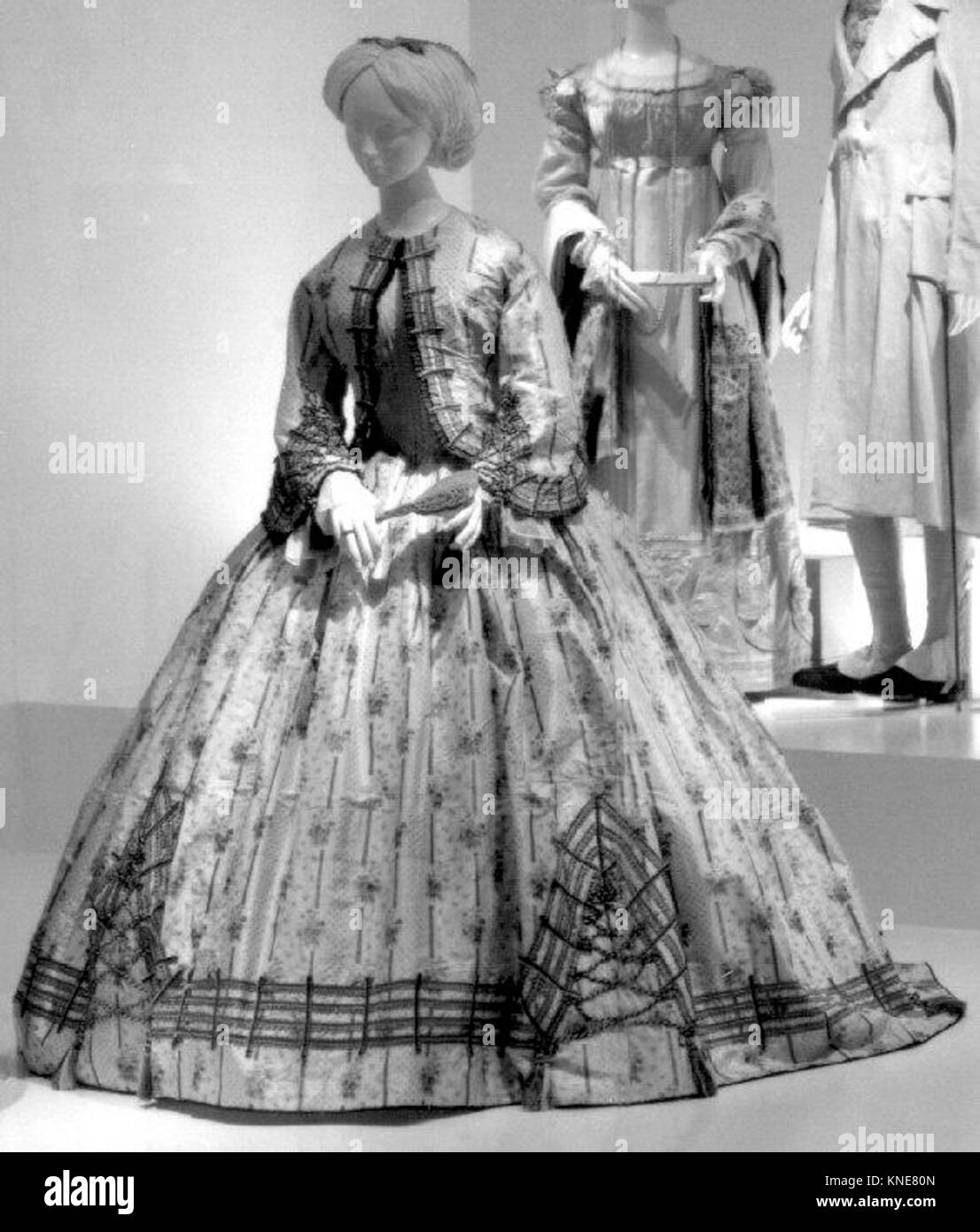 This historical dress illustrates period fashion, reflecting cultural ...