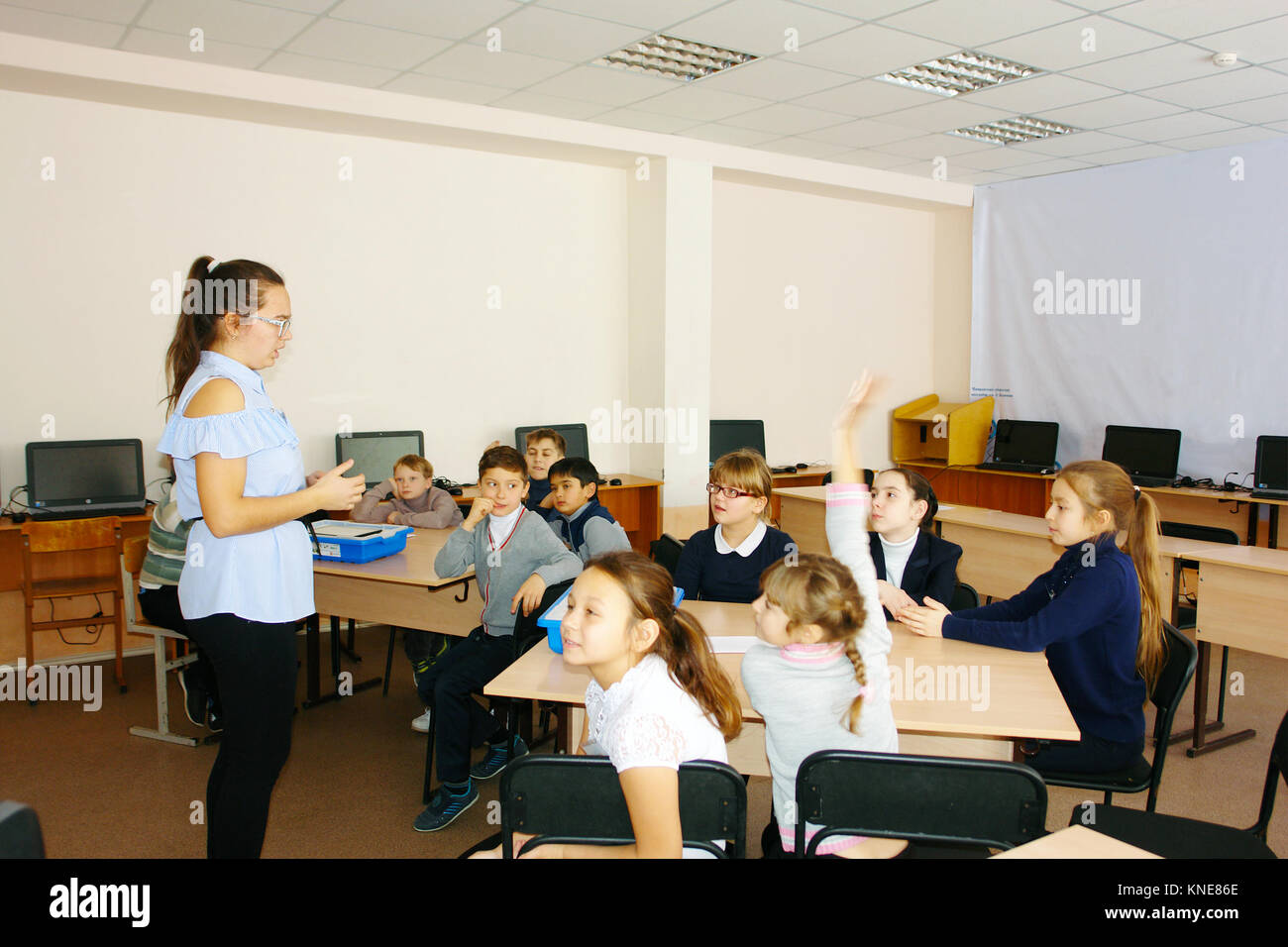 School kids in class with teacher woman Stock Photo - Alamy