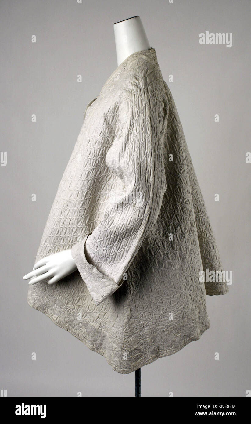 This early 20th-century dressing jacket features distinct fabric ...