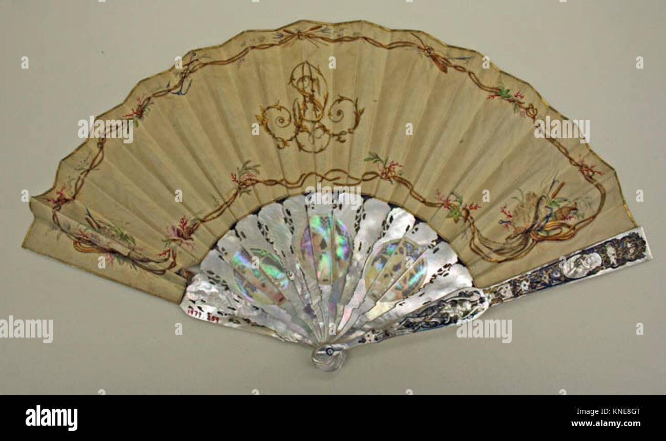 A decorative fan, showcasing intricate design and craftsmanship. The ...