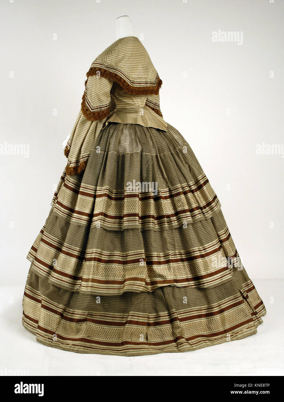 This dress is a historical garment that reflects the fashion and ...