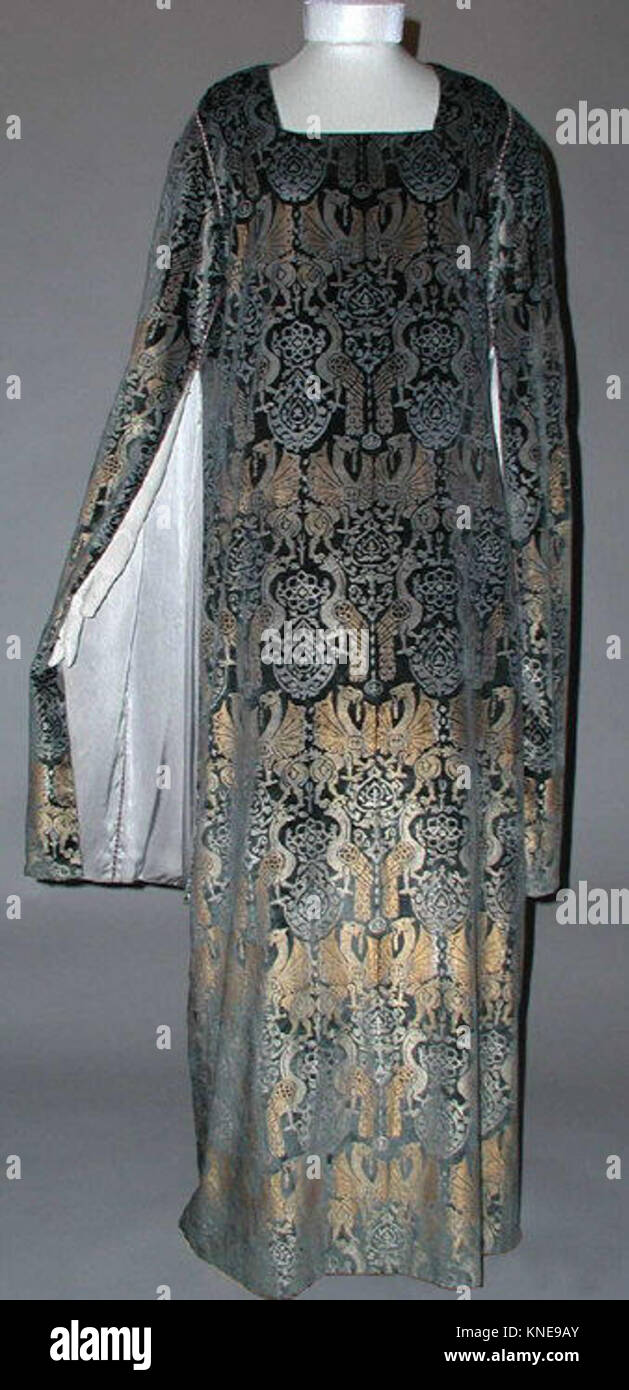 This evening ensemble is a finely designed outfit, showcasing haute ...