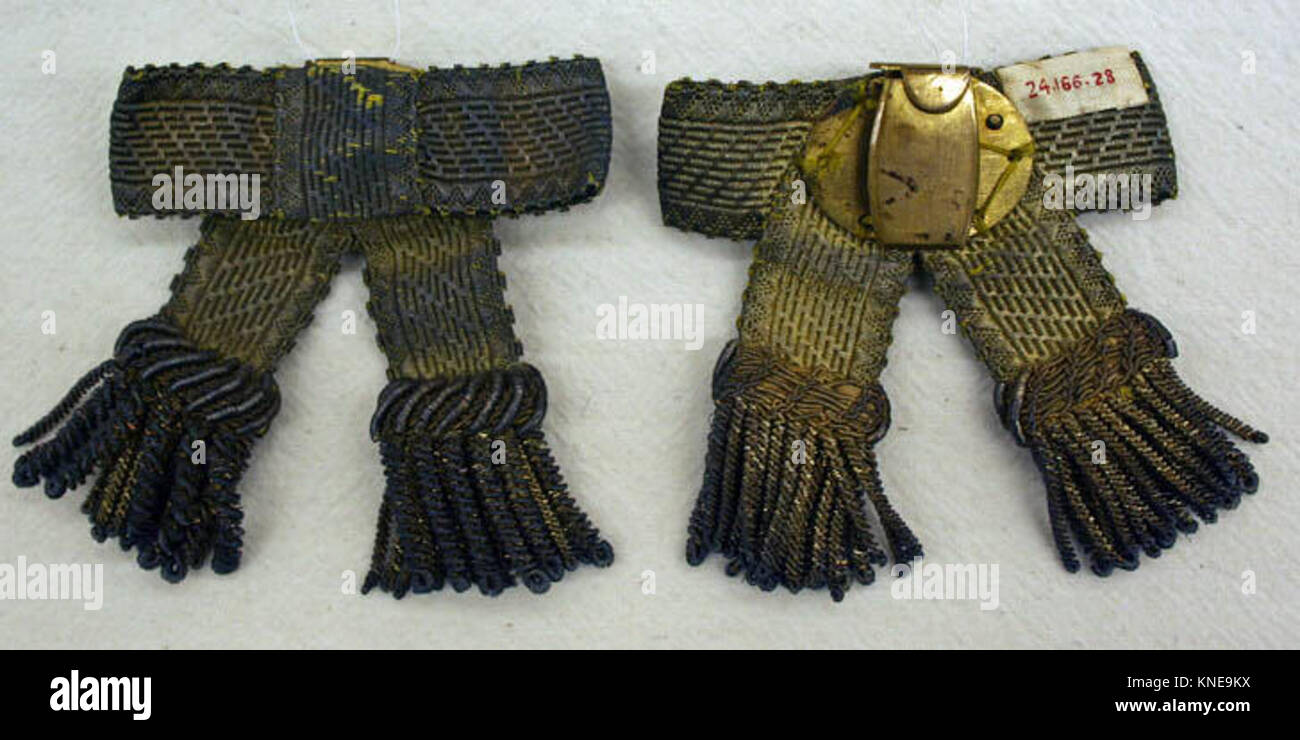 These garters, crafted with detailed ornamentation, showcase the ...