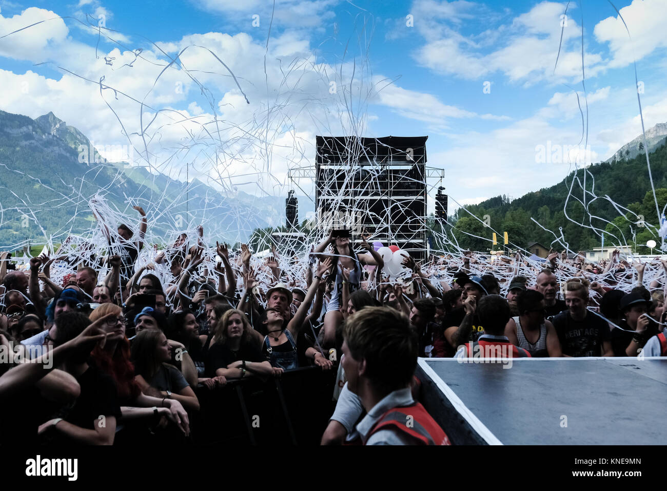 Festival goers attend a live concert with the German metal band In ...