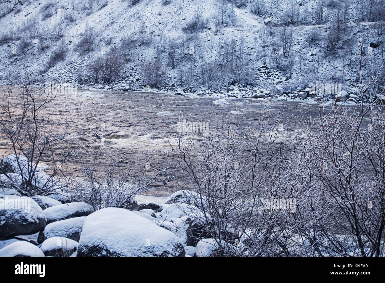 Winter river flowing through the rocks and hill Stock Photo - Alamy