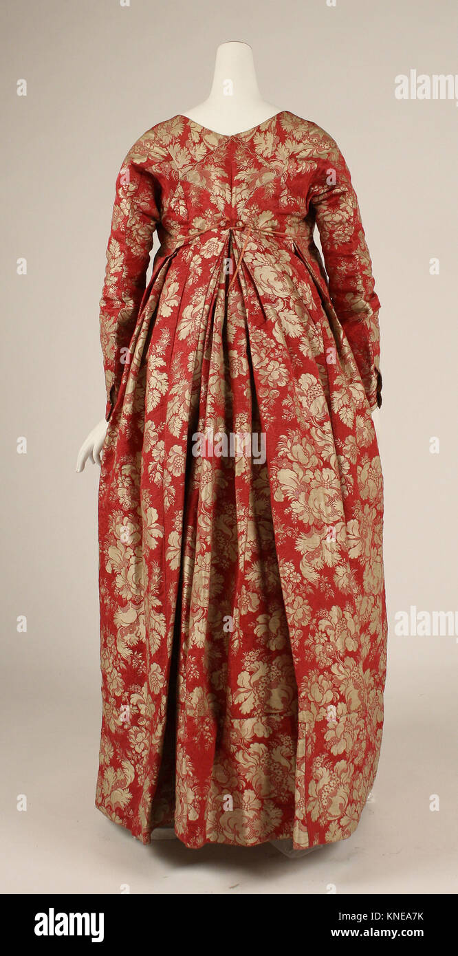 This dress, a fine example of period fashion, features intricate design ...