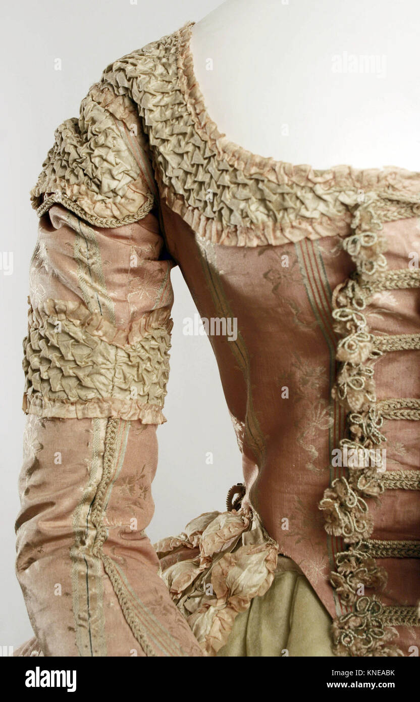 This historical dress, part of a larger collection of clothing, offers ...