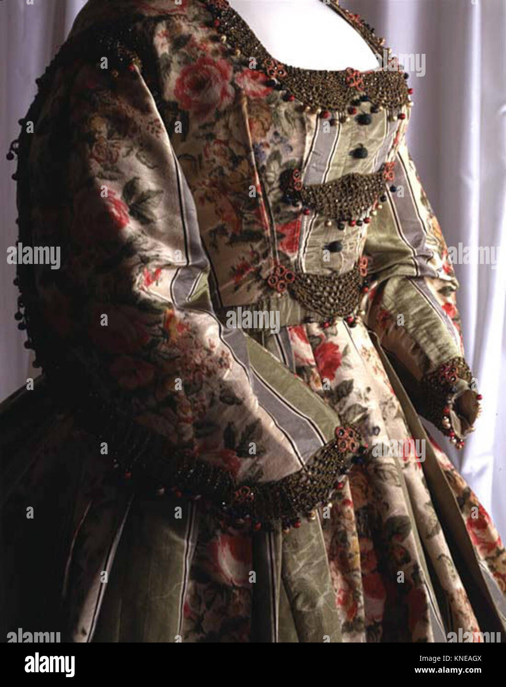 This dress exemplifies historical fashion design, reflecting the ...