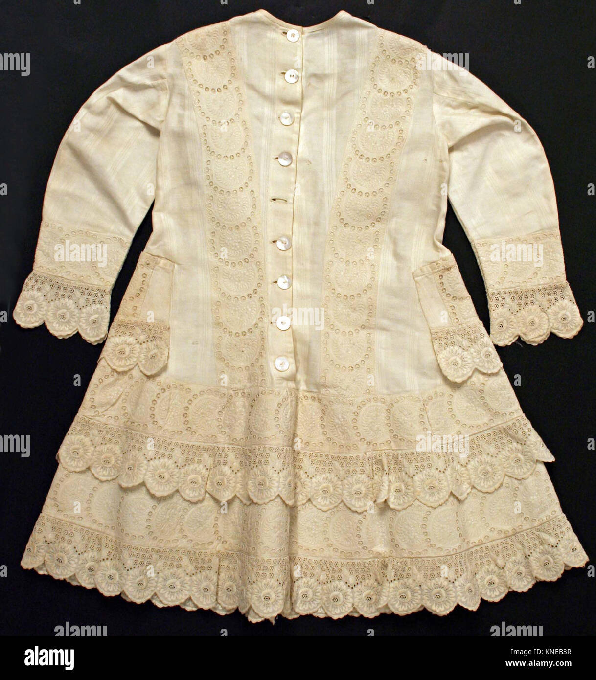 This dress, made from fine textiles, reflects the fashion and style ...