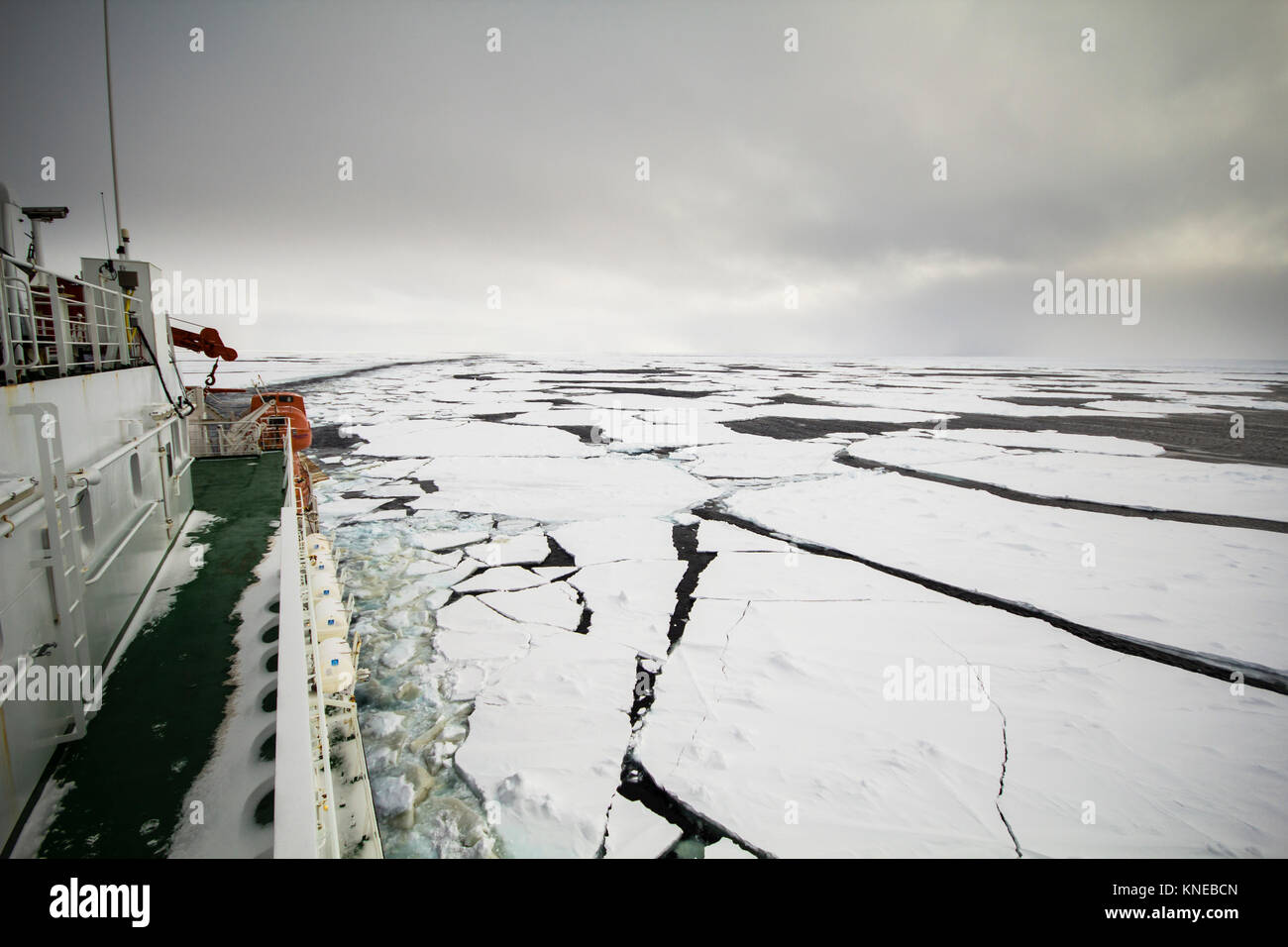 Research icebreaker cruising in frozen ocean by breaking ice at polar ...