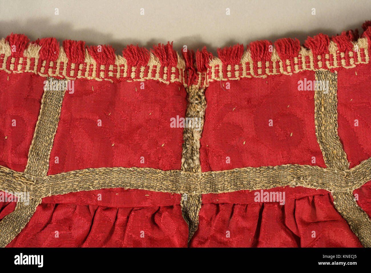 This historical cape features intricate design elements and ...