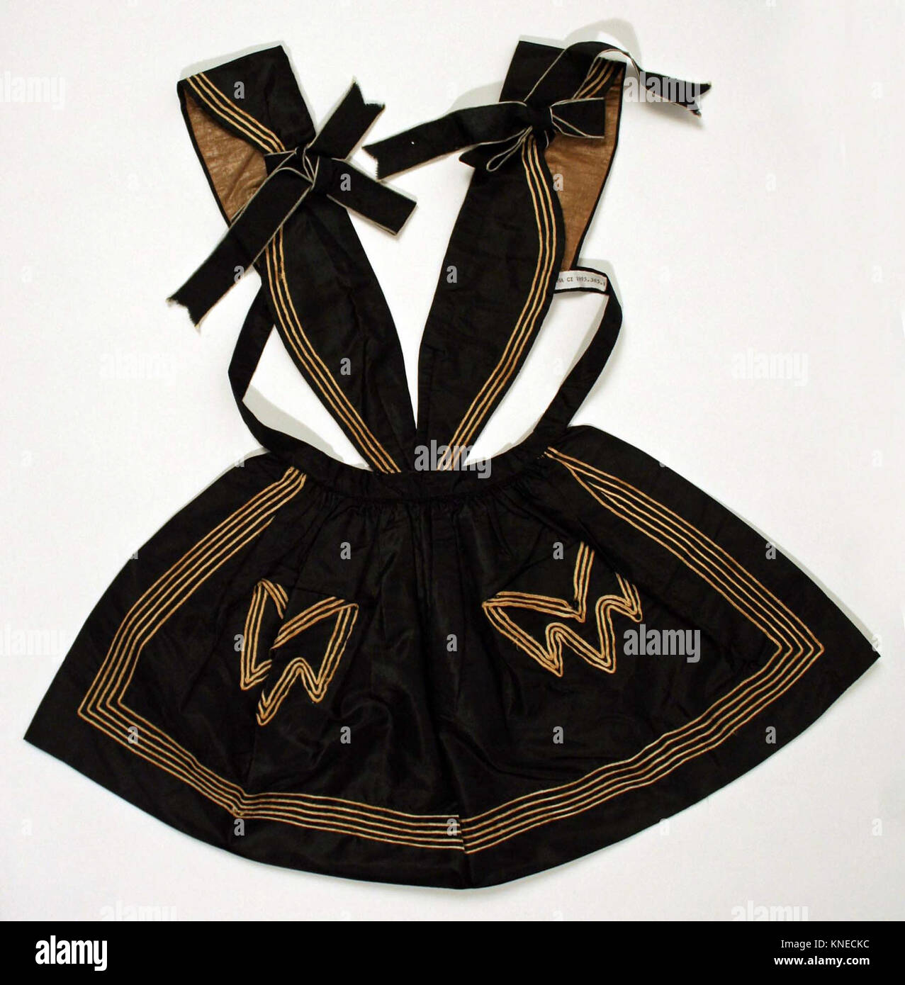 This apron, cataloged as MET 1991.385.1, is a representative piece of ...