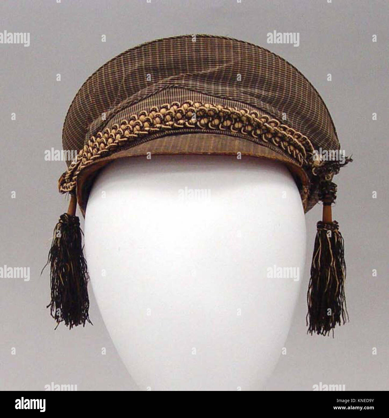 This is a detailed cap, showcasing fine craftsmanship and design. It ...