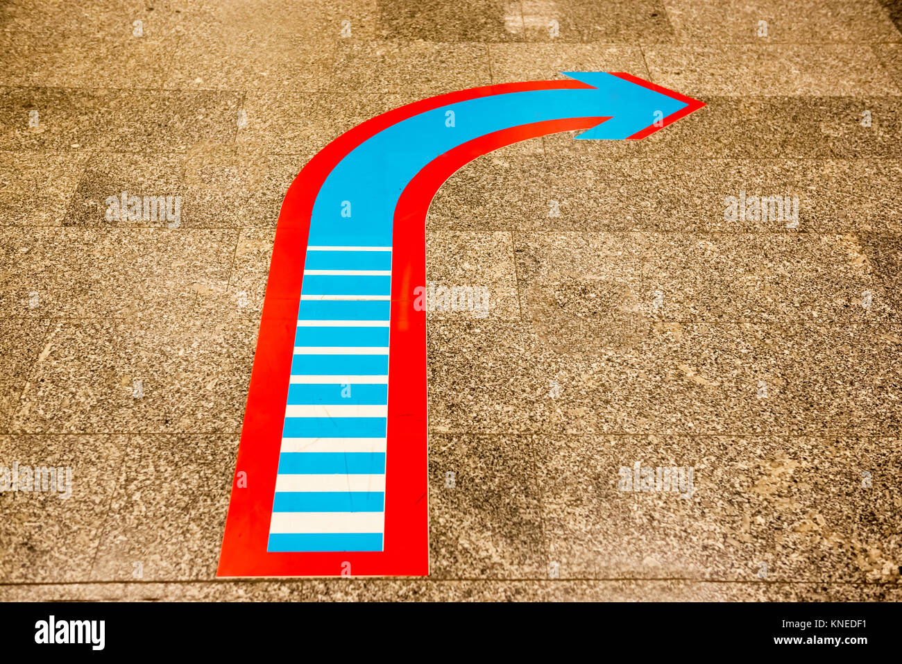 Arrow Signboard on the marble ground shows direction of right turn.Copy ...