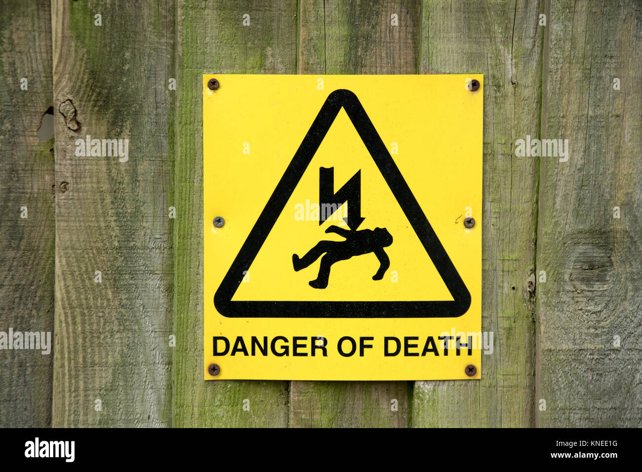 Sign warning of danger of death from electricity Stock Photo - Alamy