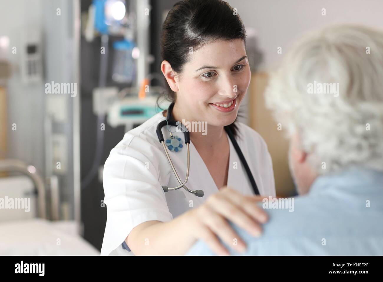 Doctor comforting patient in hospital hi-res stock photography and images - Alamy