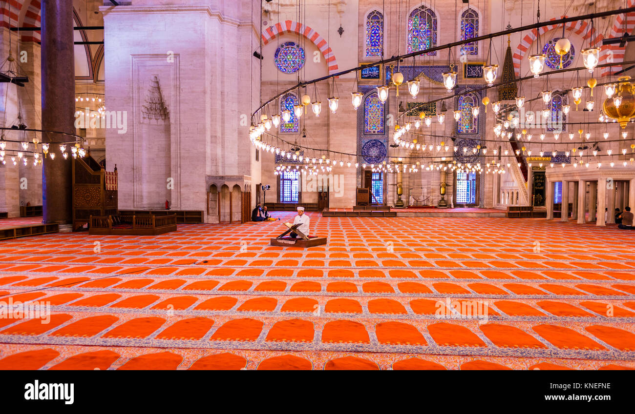 Turkish imam reading Koran in Suleymaniye mosque,decorated with Islamic ...