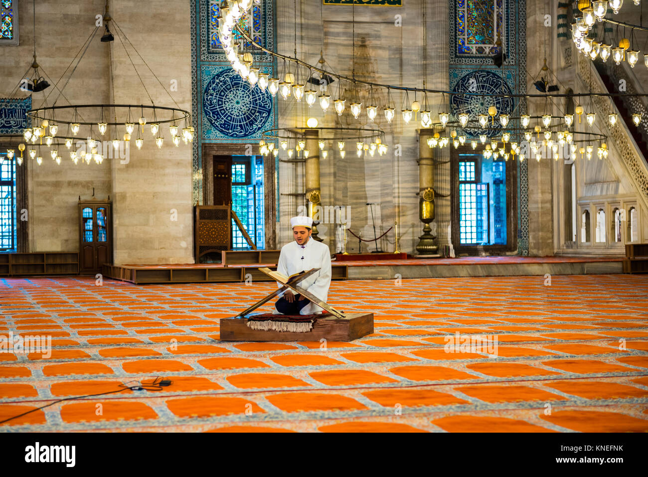 Turkish imam reading Koran in Suleymaniye mosque,decorated with Islamic ...