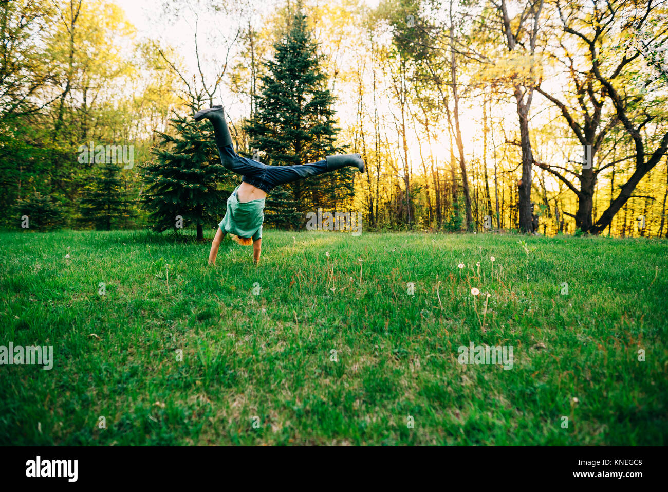 Boy doing a cartwheel hi-res stock photography and images - Alamy
