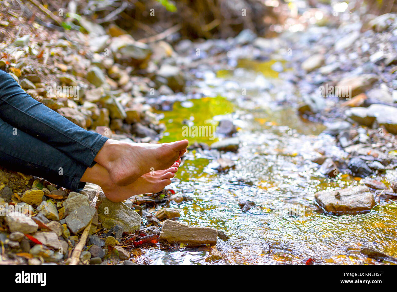 Woman sitting stream taking hi-res stock photography and images - Alamy