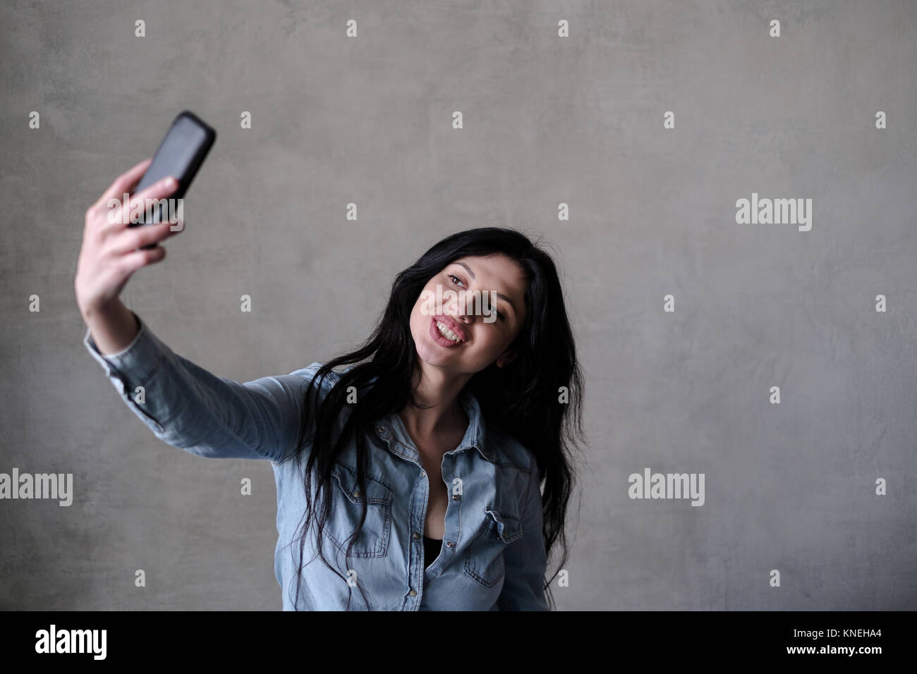 Woman taking a selfie Stock Photo - Alamy
