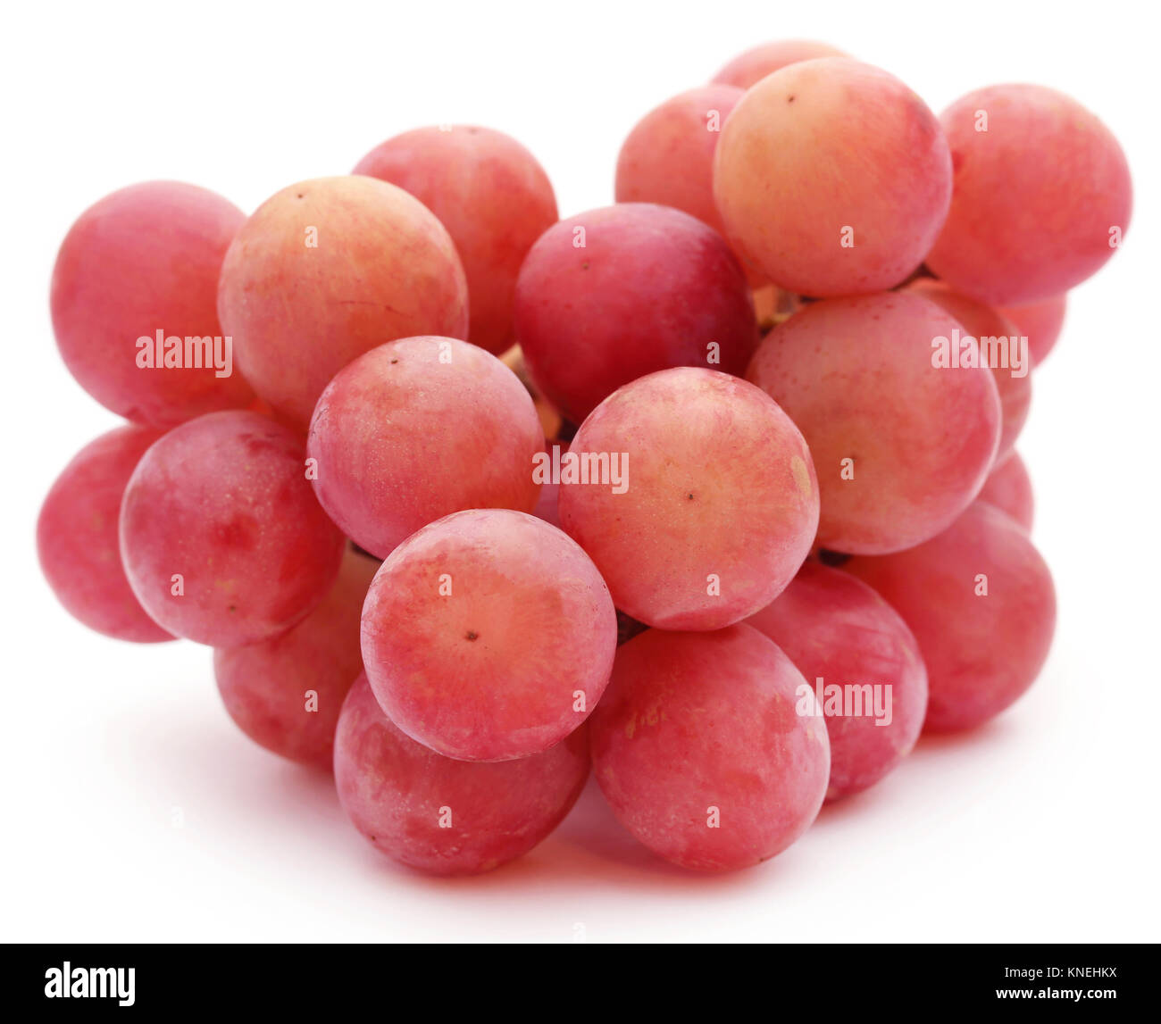 Organic red grapes over white background Stock Photo - Alamy