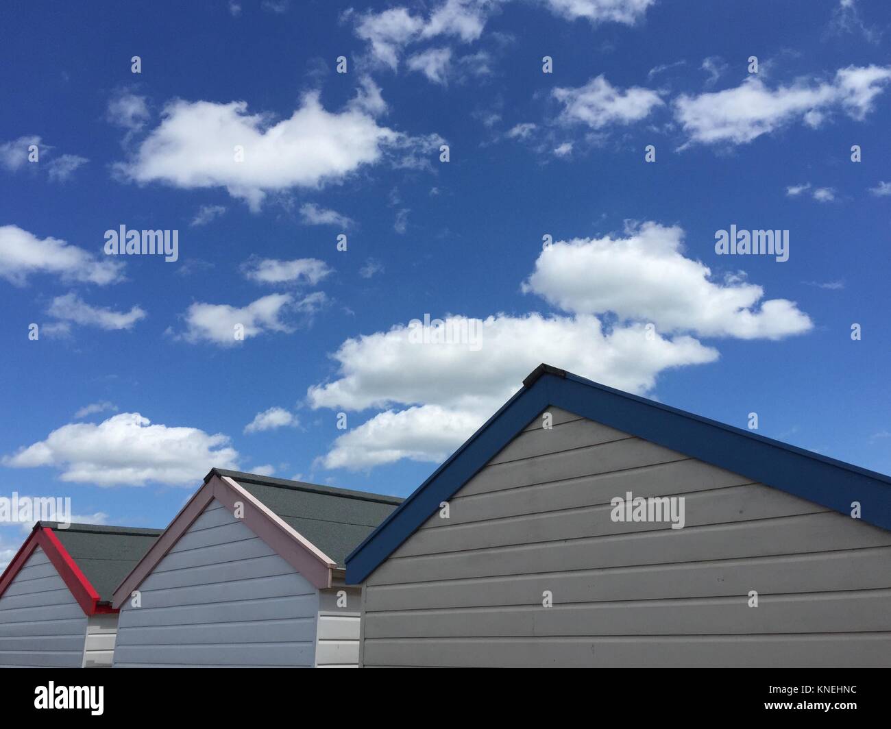 Generic beach huts on the beach Stock Photo - Alamy