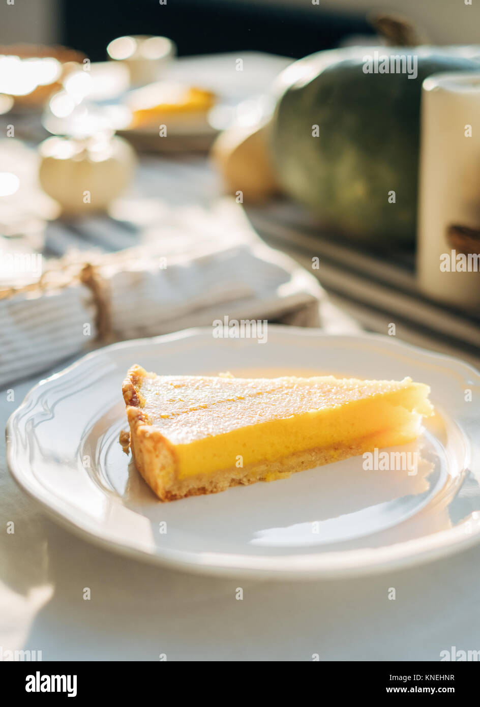 Slice of lemon tart on a plate Stock Photo - Alamy